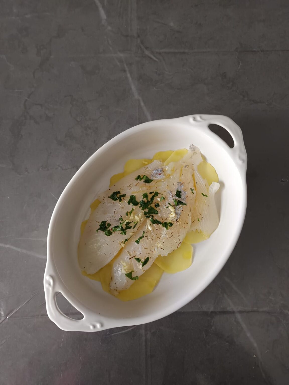 Filetti di pesce San Pietro in crosta di patate